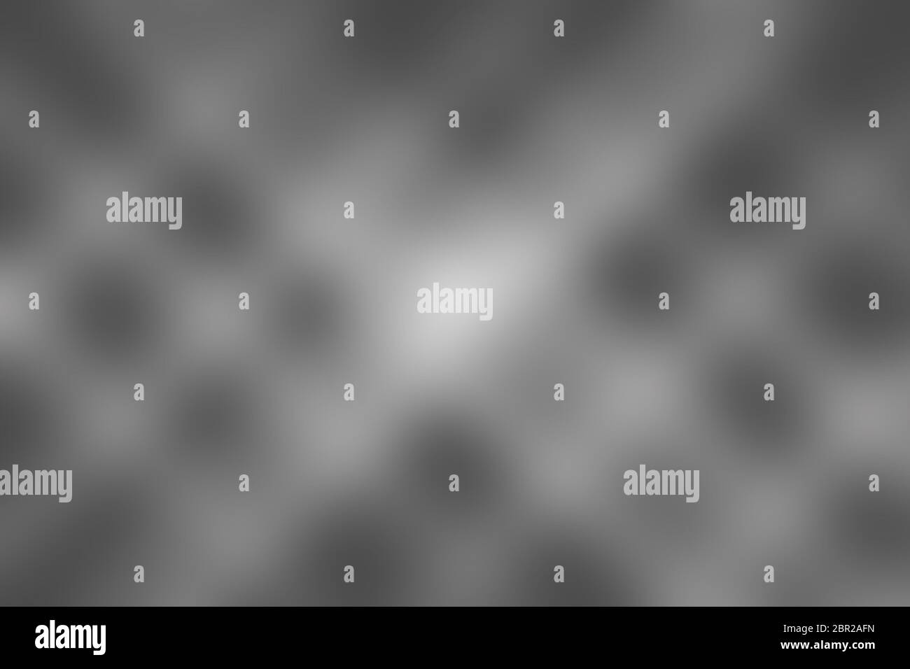 Subdued gray and white cloudy blurred effect background with space for ...