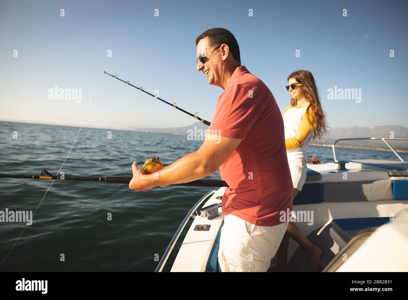 Man using fishing rod hi-res stock photography and images - Alamy