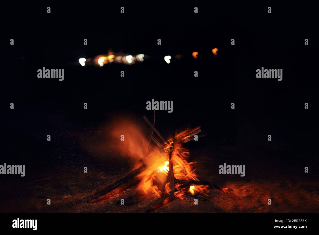 Abstract night sky with city lights and camp fire outside Stock Photo ...