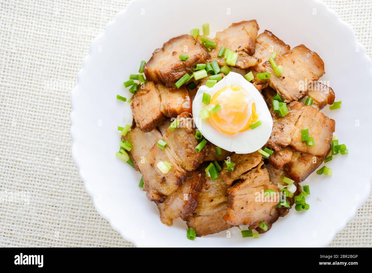 Bowl of rice topped with Braised pork belly and boiled egg, Japanese ...