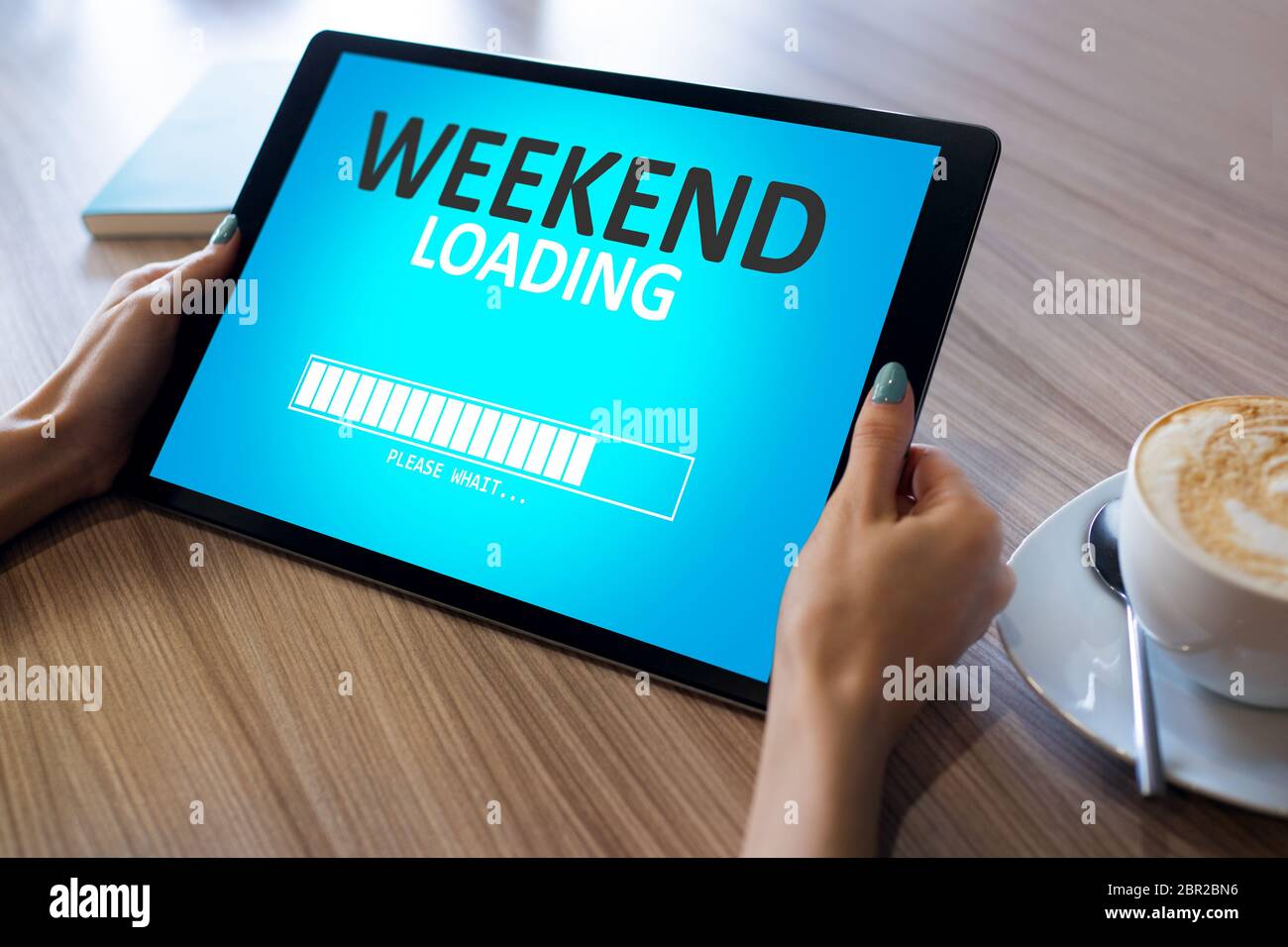 Weekend loading status bar message on device screen Stock Photo - Alamy