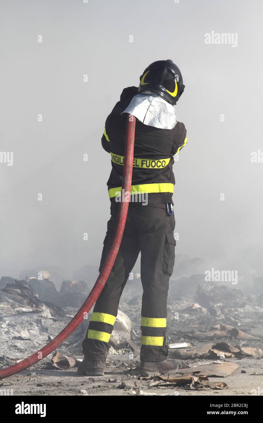 firefighter in the smoke fire Stock Photo - Alamy