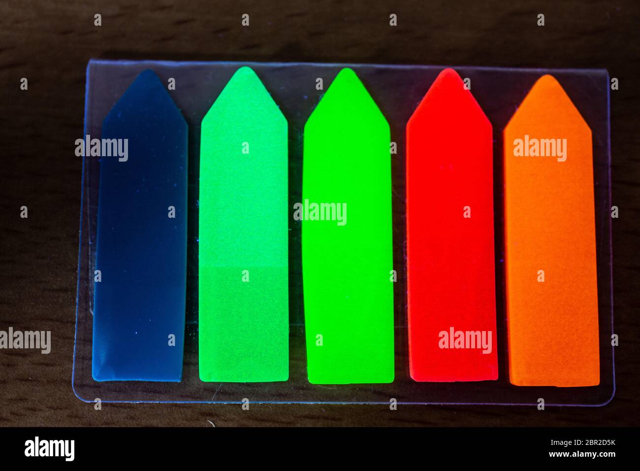 Arrows with luminous color in UV light Stock Photo - Alamy