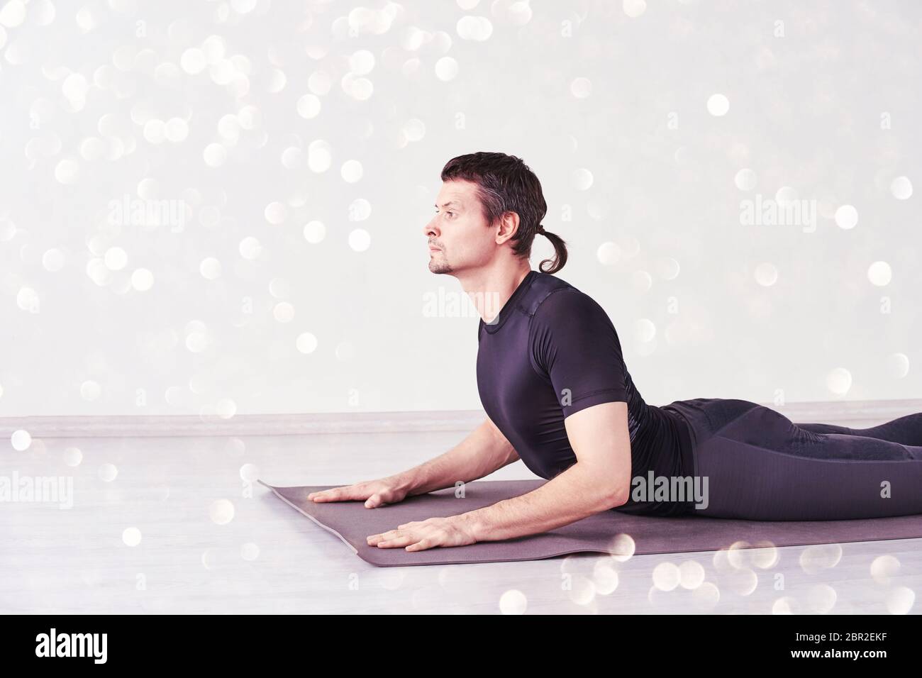 Man in yoga asana. Home studio. One person Stock Photo - Alamy