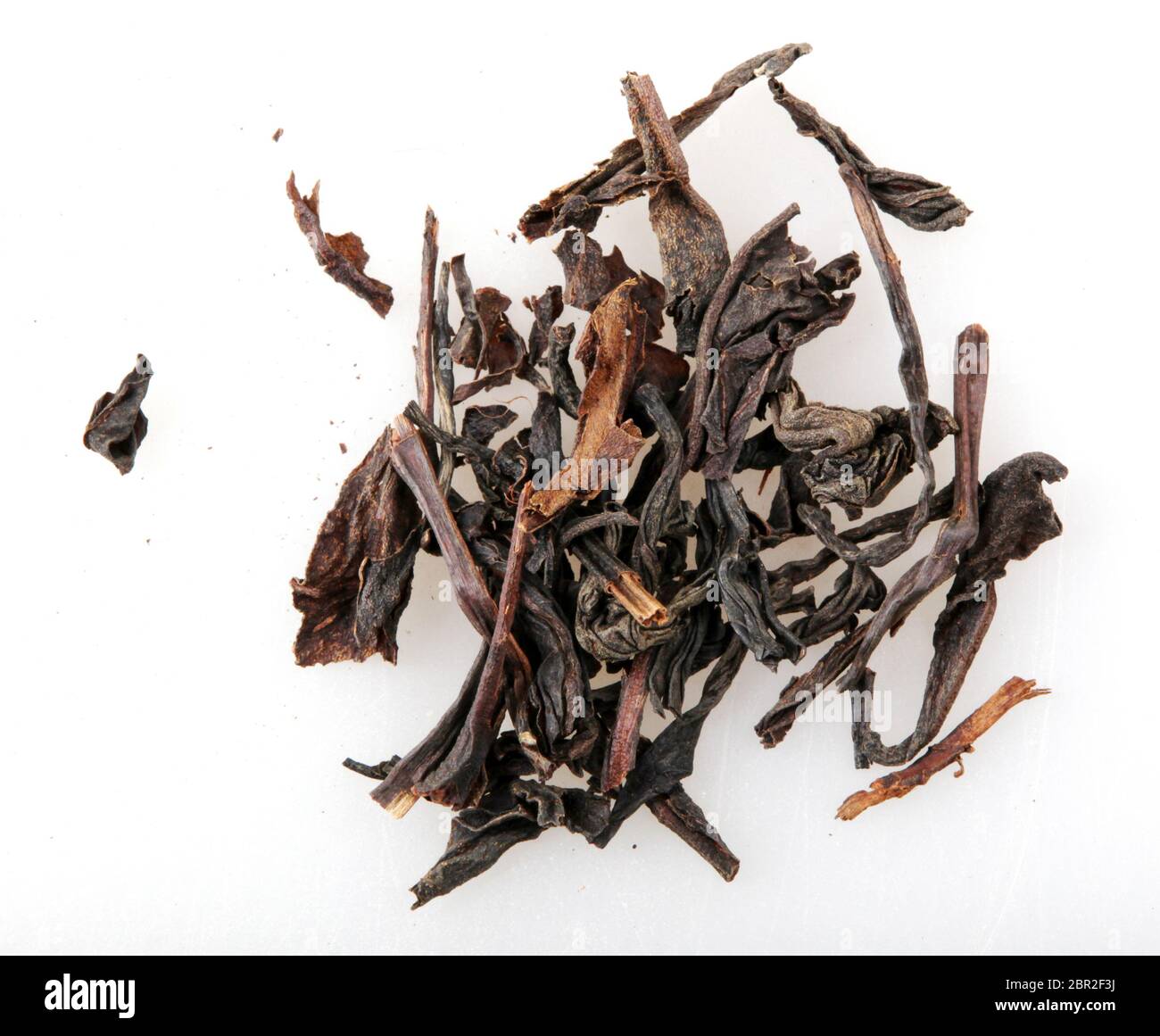 Black Dry Tea Leaves Isolated On White Background Stock Photo - Alamy