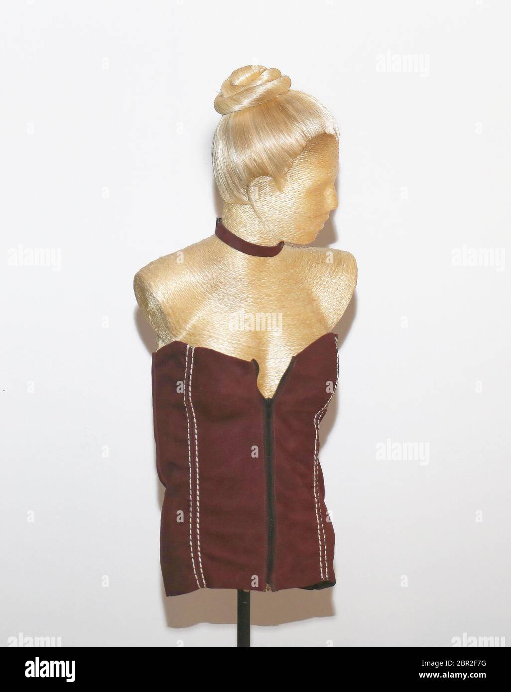 Retro female mannequin with fashionable clothing garment on white ...