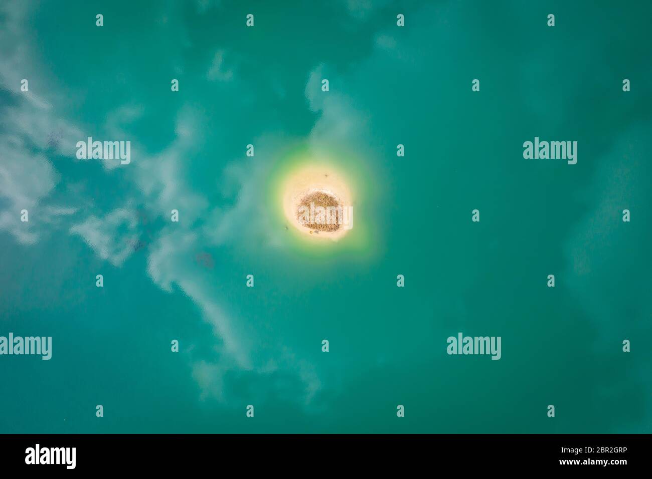 Aerial top down view of small island. Birds eye view of beautiful green ...