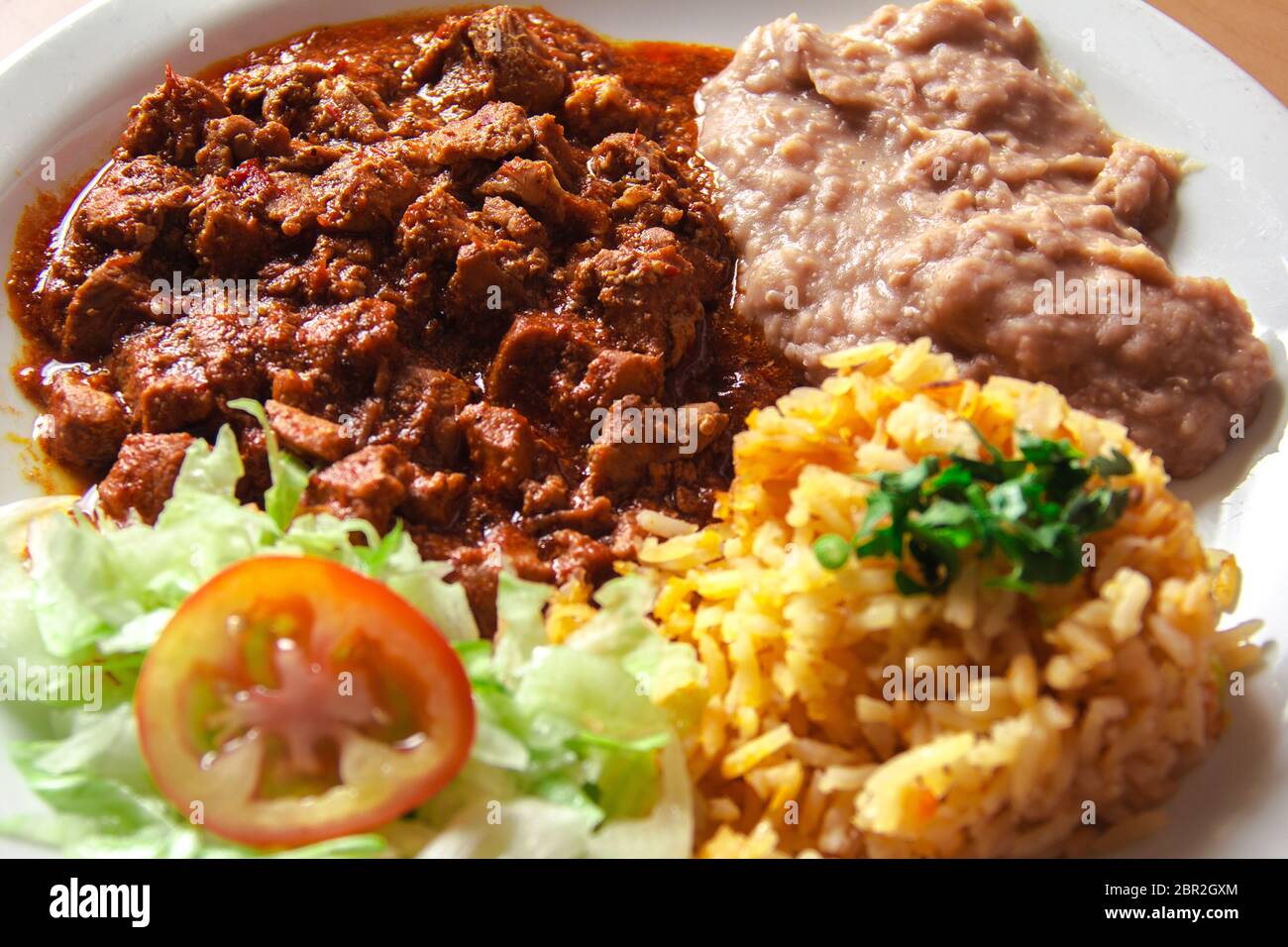 Pork with beans and rice Stock Photo - Alamy
