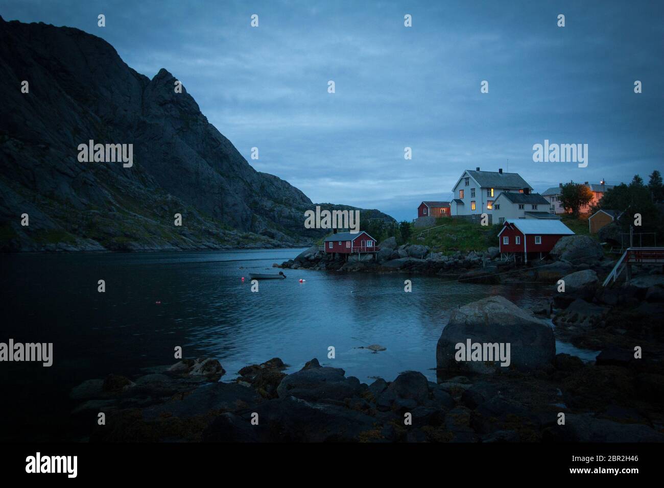 A moody fishing village at dusk on Lofoten Island, above the arctic ...