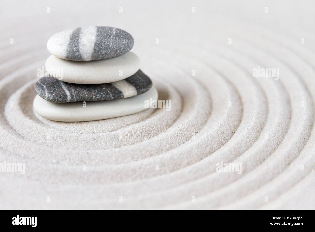 Black and white stones in the sand. Zen japanese garden background ...