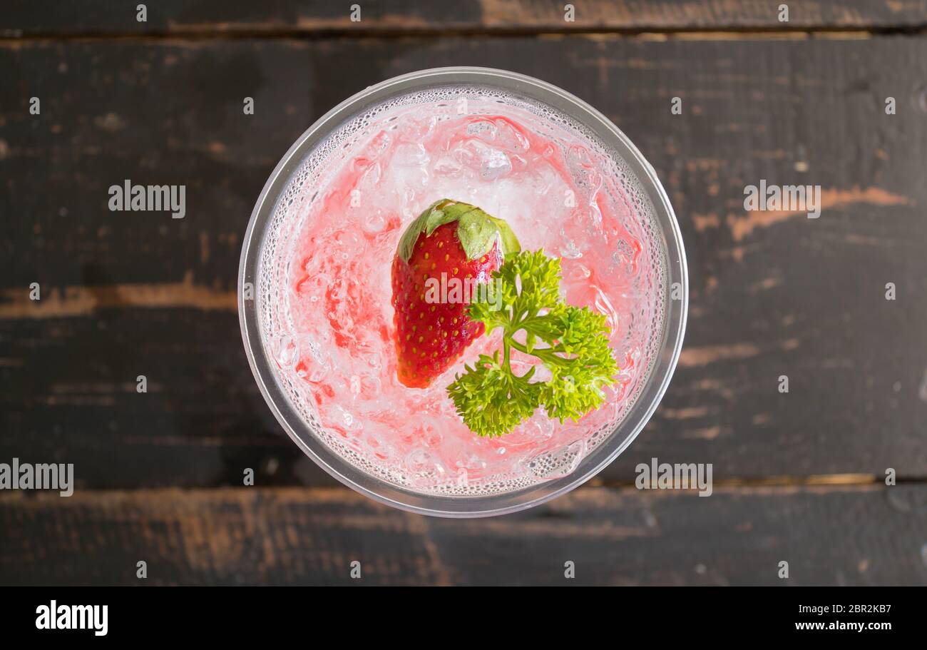 Red Italian Soda Cold Beverage and Strawberry Fruit and Parsley. Red ...