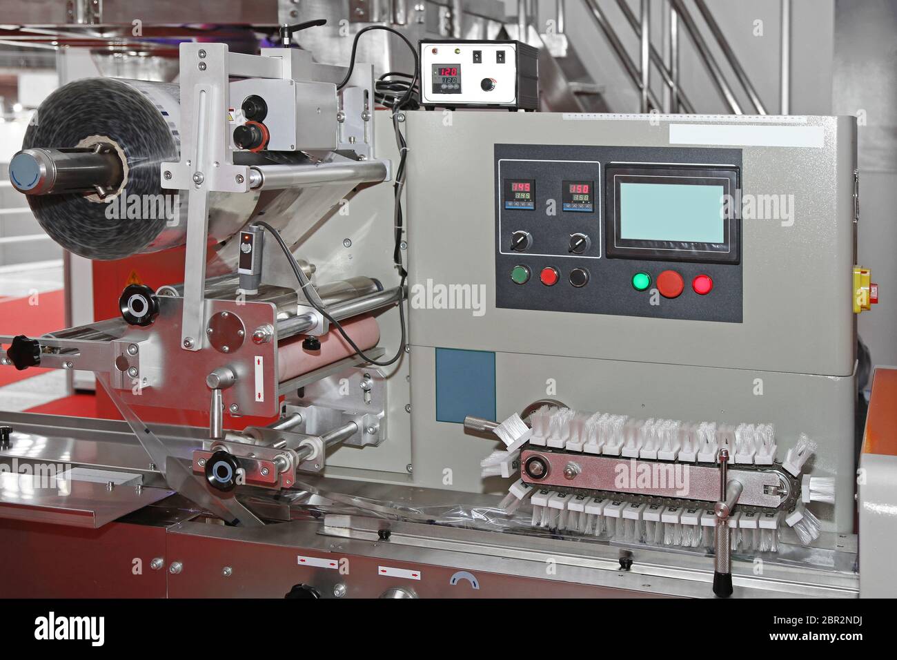 Packing Machine at Food Production Line in Food Factory Stock Photo - Alamy