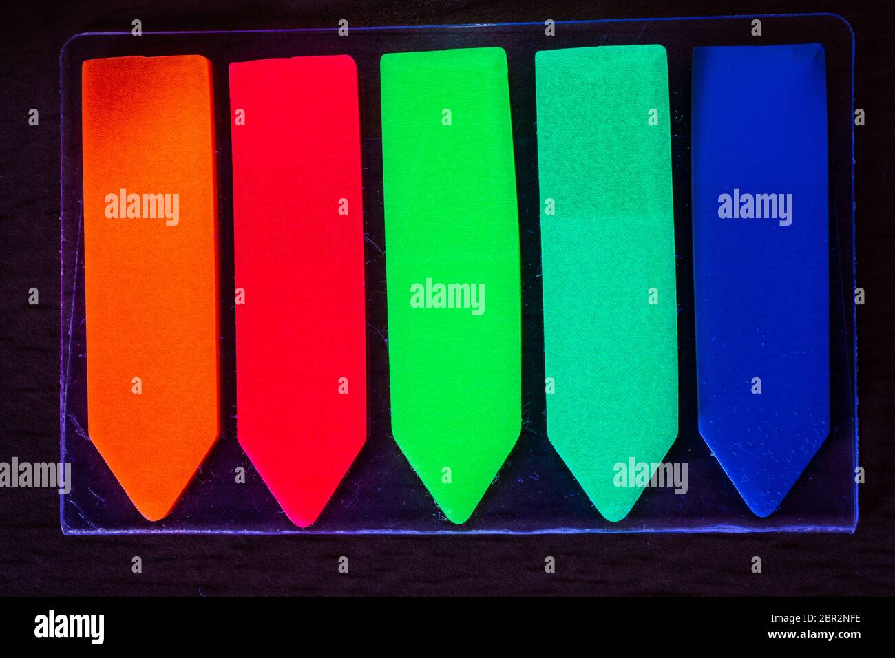 Arrows with luminous color in UV light Stock Photo - Alamy