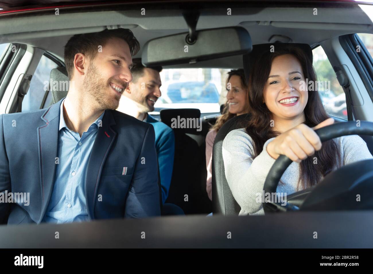 Group Of Happy Friends Having Fun In The Car Stock Photo - Alamy