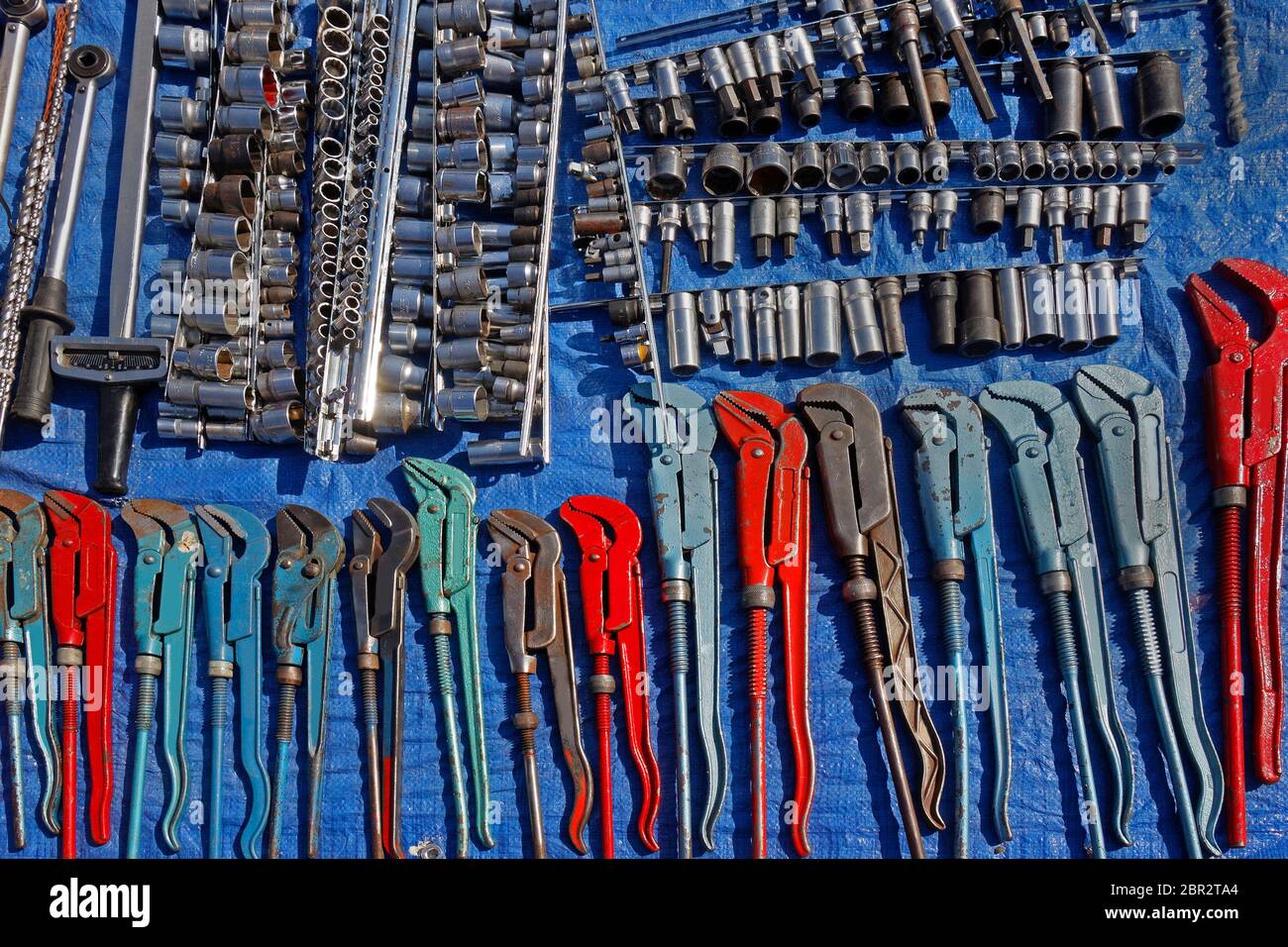 Old manual metal pliers sold outside on flea market Stock Photo - Alamy