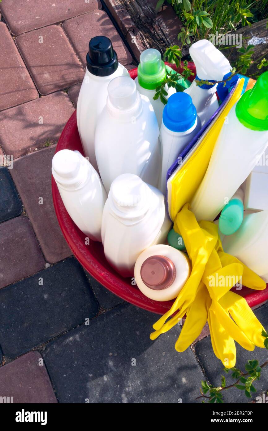 Cleaning supplies, group of colorful plastic bottles outdoor, Basket ...