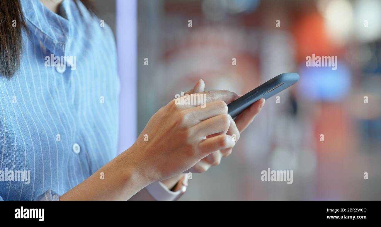 Close up of woman use of mobile phone inside shopping mall Stock Photo ...