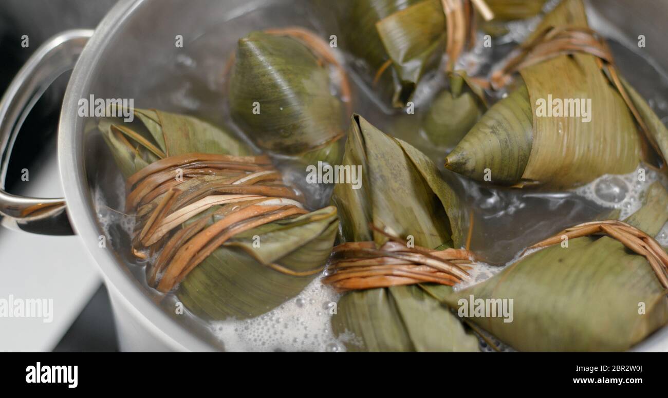 Cook sticky rice dumpling Stock Photo - Alamy