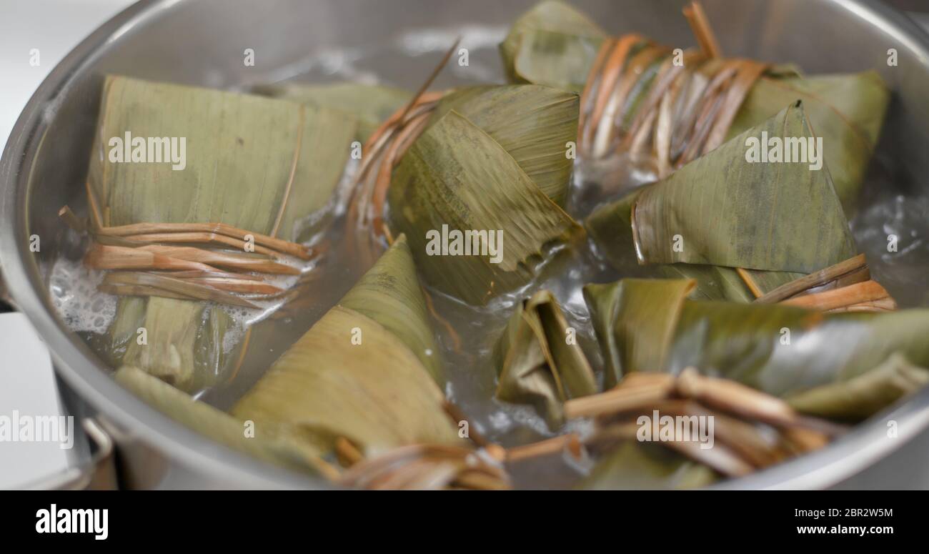 Cook with bamboo sticky rice dumpling Stock Photo - Alamy
