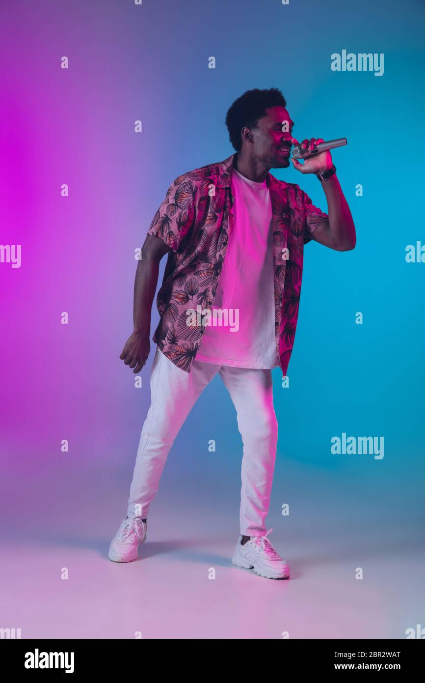 African-american male singer portrait isolated on gradient studio ...