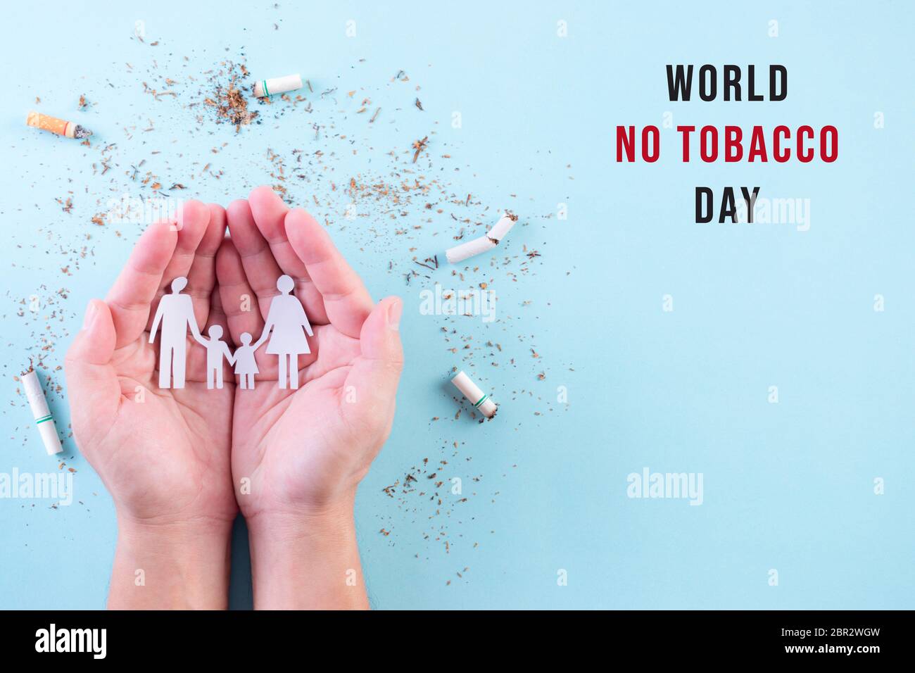 Hand protect family from cigarette on light blue background. Stop ...