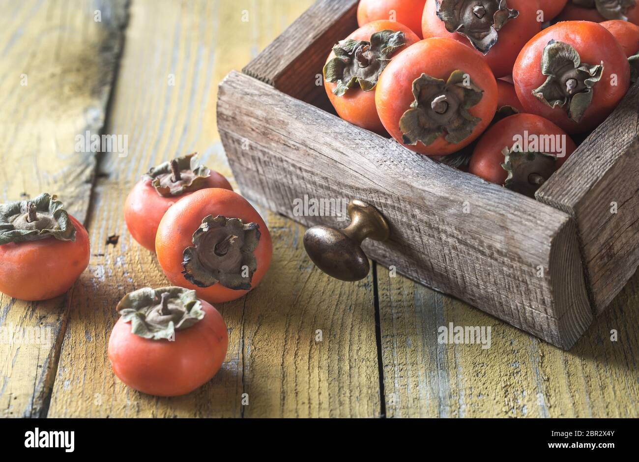 Box of persimmons hi-res stock photography and images - Alamy