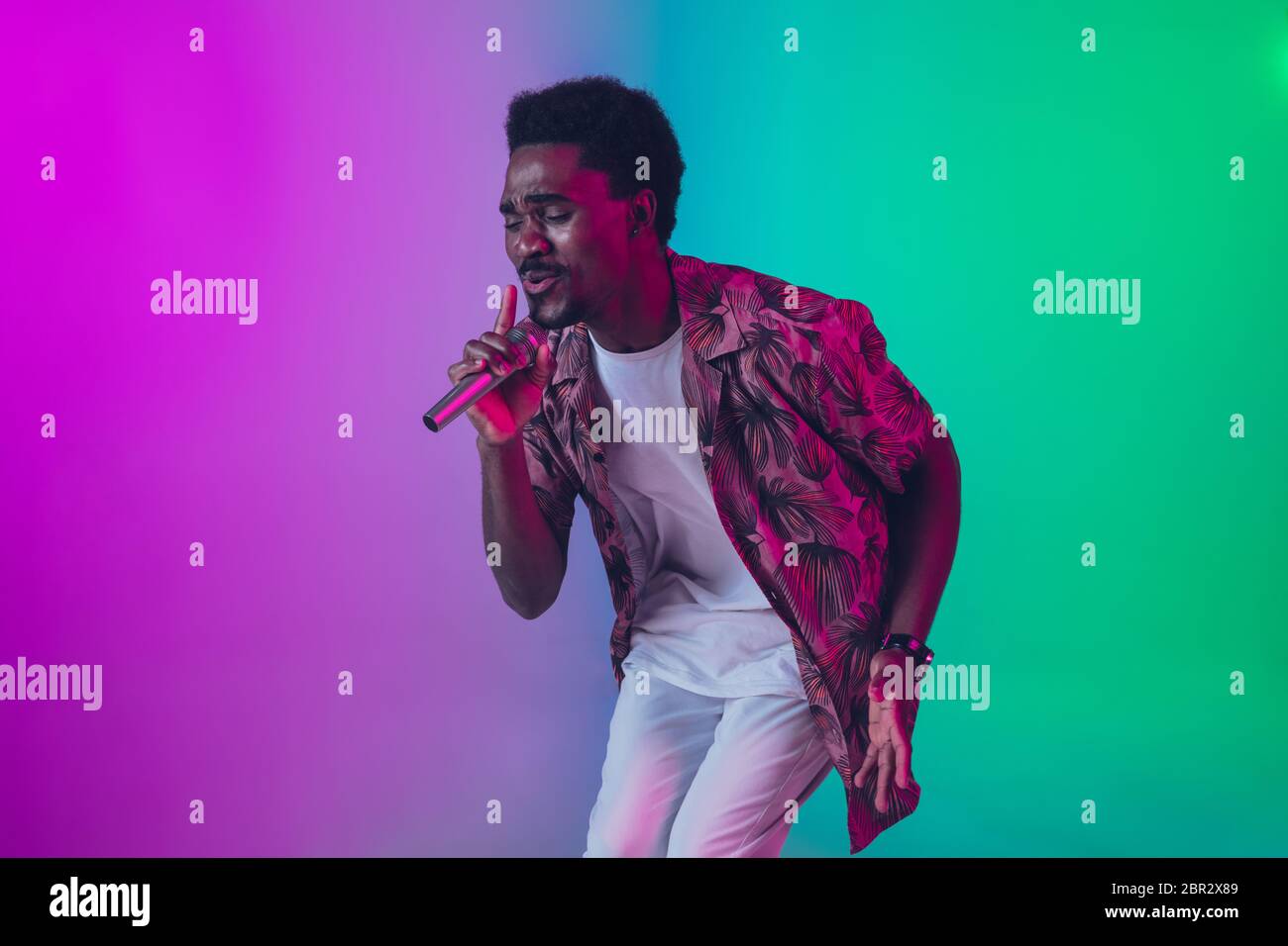 African-american male singer portrait isolated on gradient studio ...