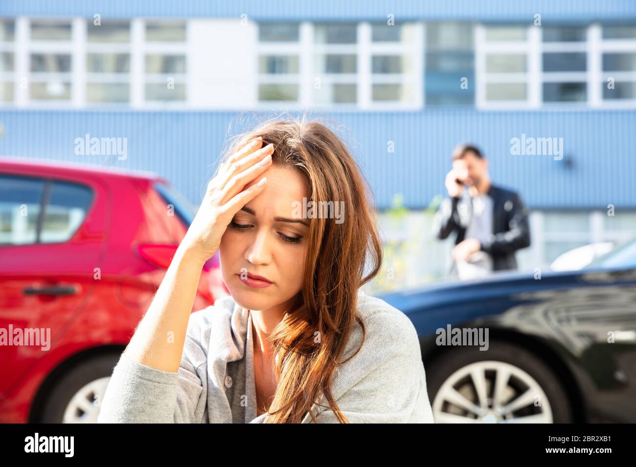 Young Depressed Female Driver After Traffic Accident Sitting On Road ...