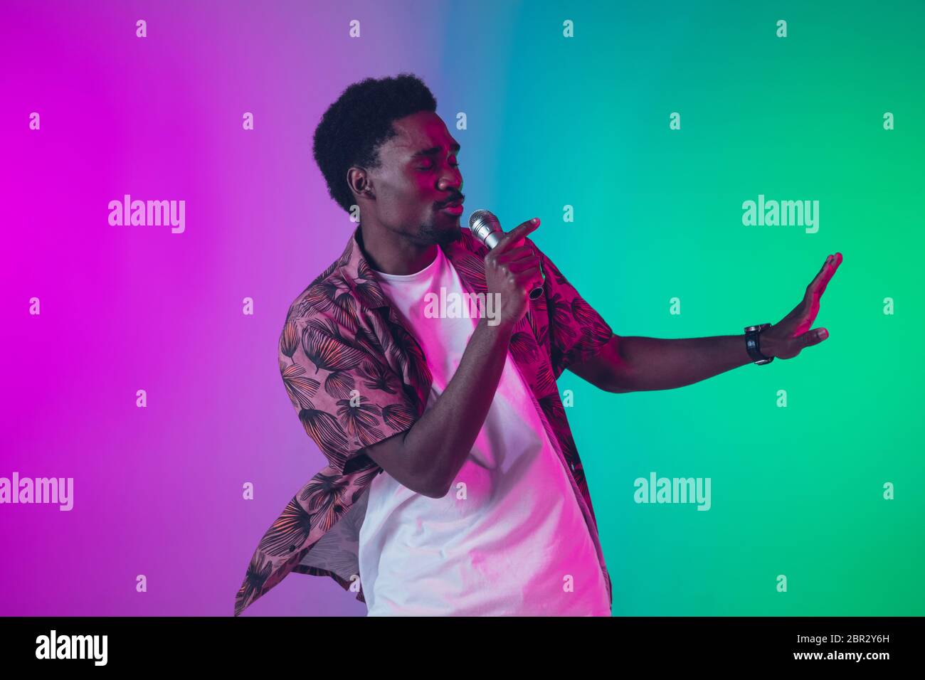 African-american male singer portrait isolated on gradient studio ...
