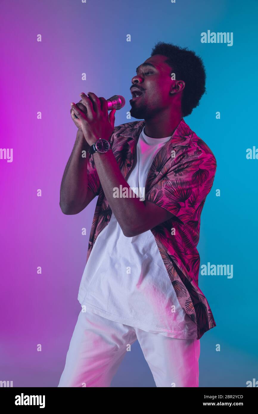 African-american male singer portrait isolated on gradient studio ...