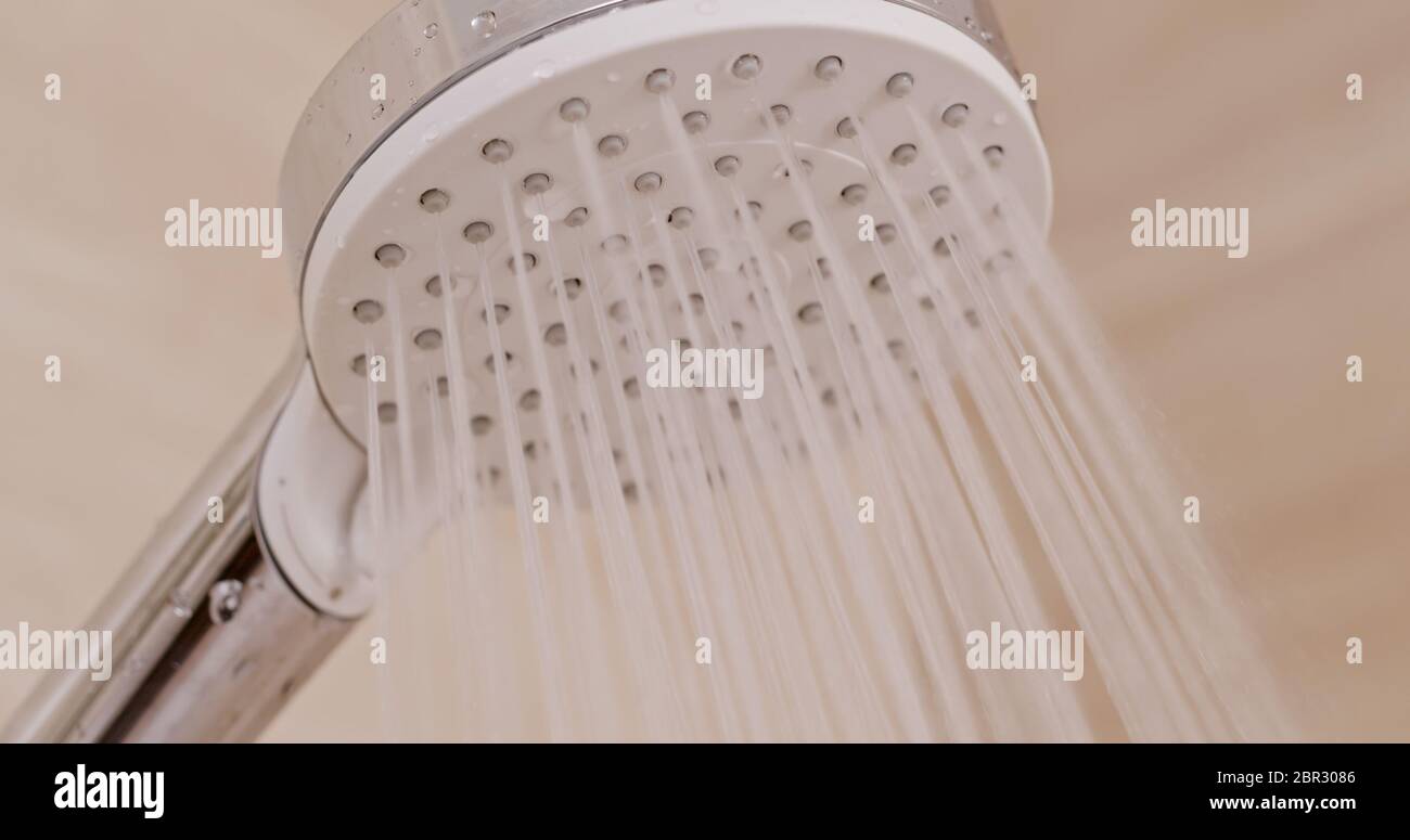 Water flow in the shower head Stock Photo - Alamy