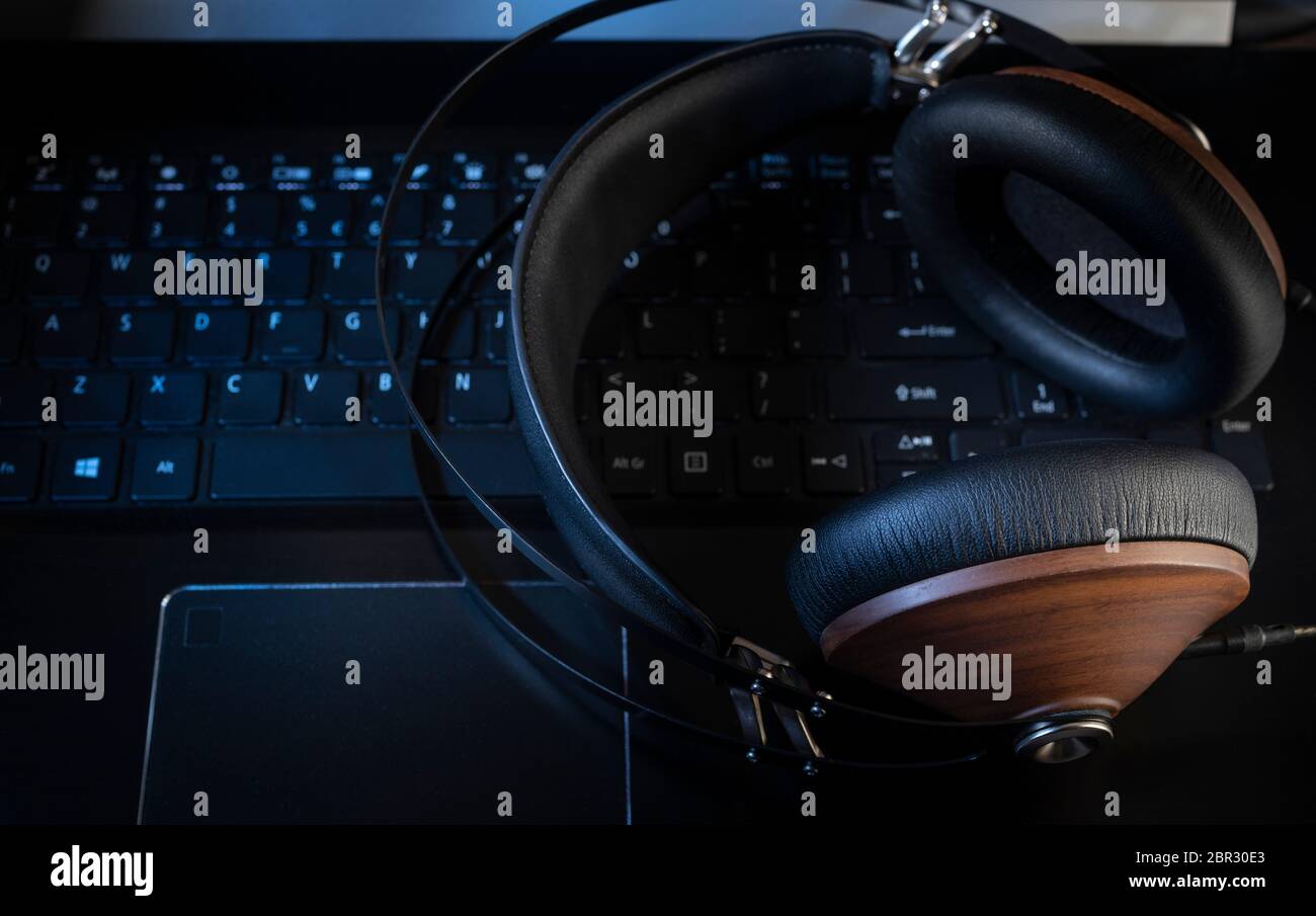 Hi-Fi headphones and computer in a home-studio audio recording and ...