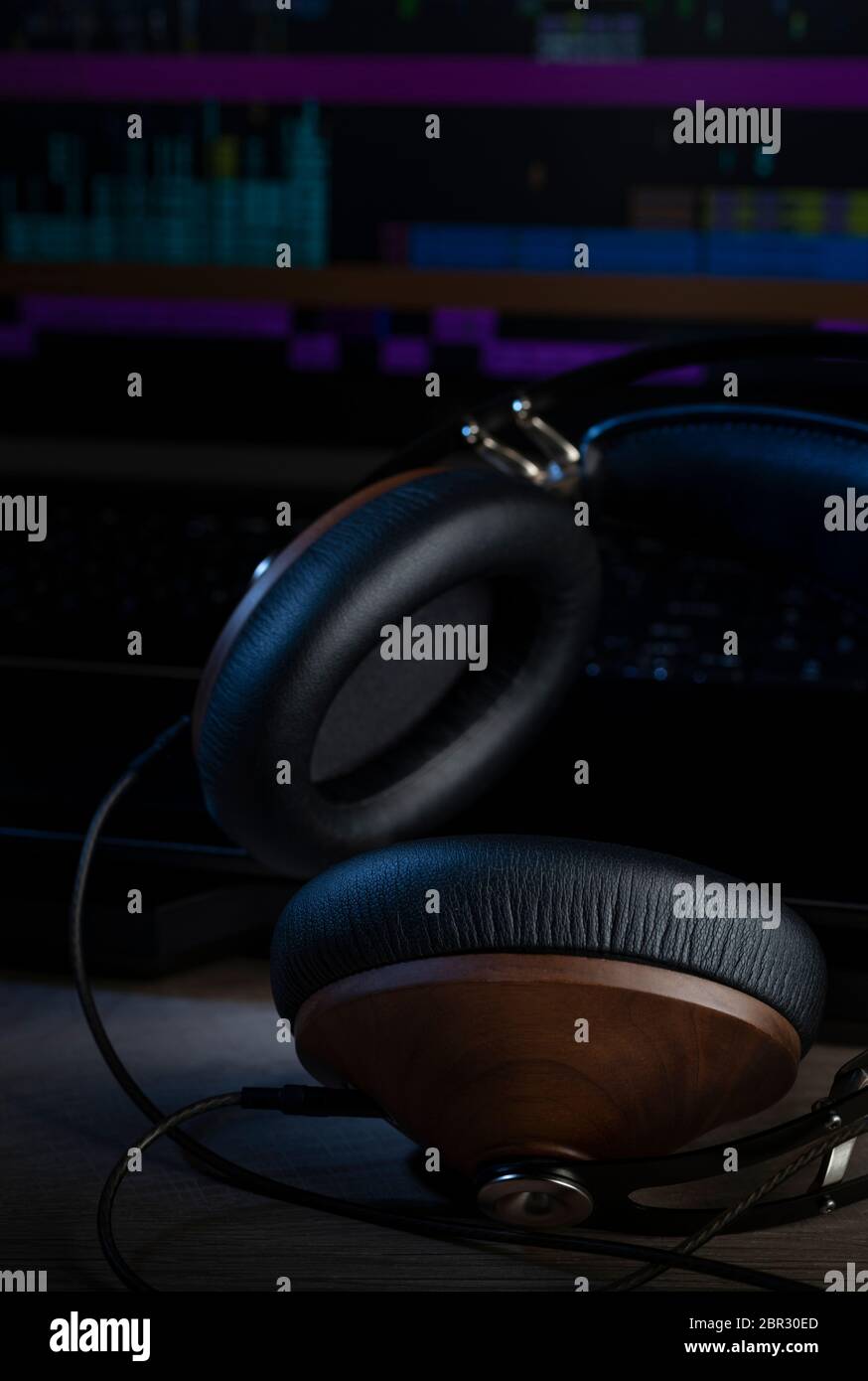 Hi-Fi headphones and computer in a home-studio audio recording and ...