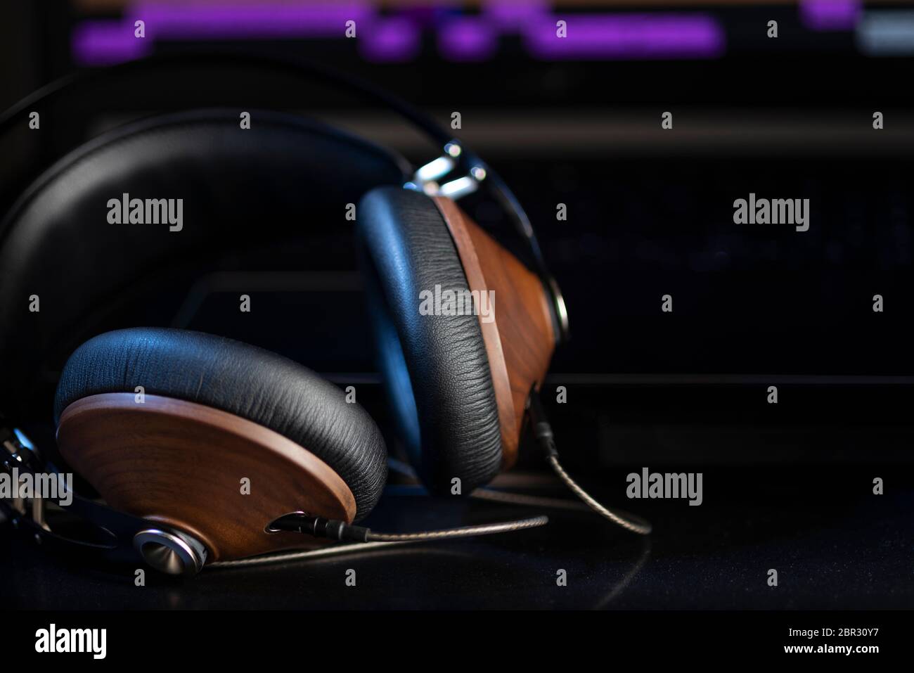 Hi-Fi headphones and computer in a home-studio audio recording and ...