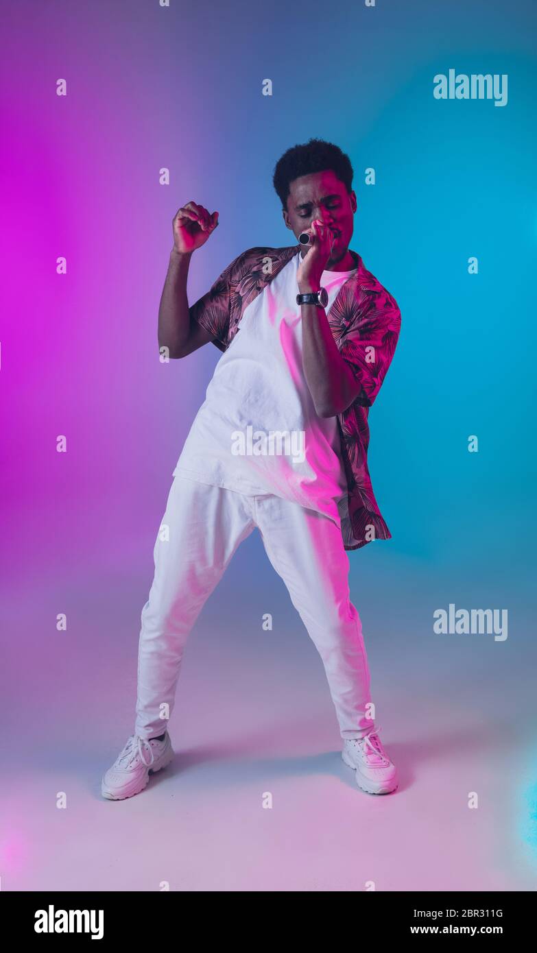 African-american male singer portrait isolated on gradient studio ...