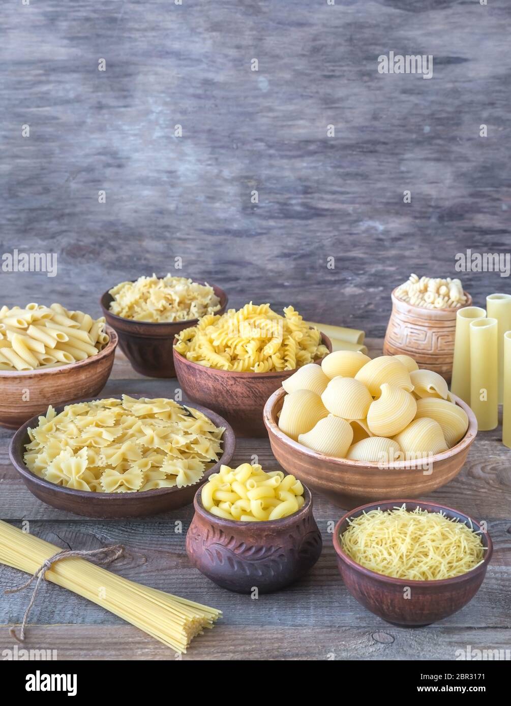 Various types of pasta on the white background Stock Photo - Alamy