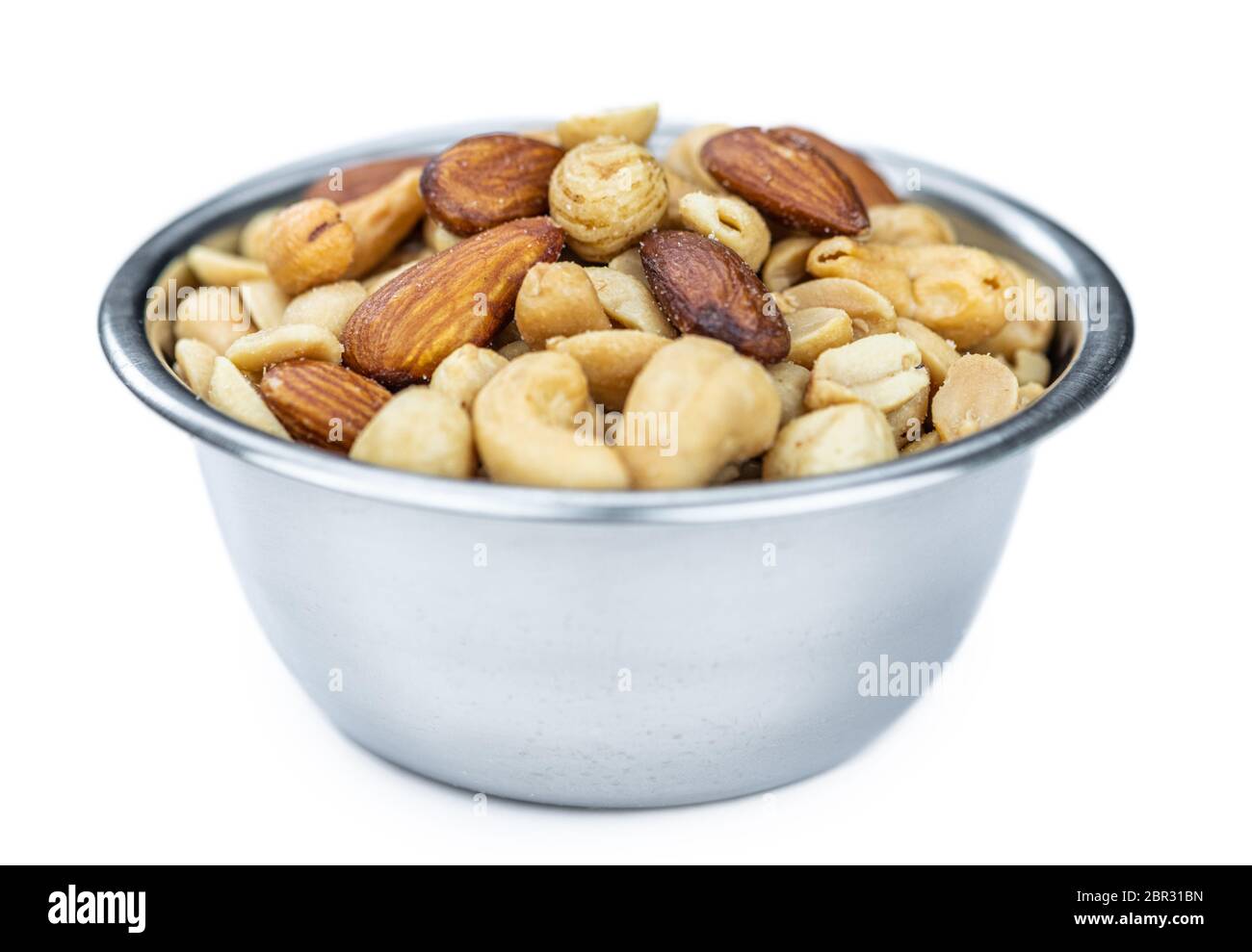 Fresh roasted nuts isolated on white background as close up shot ...
