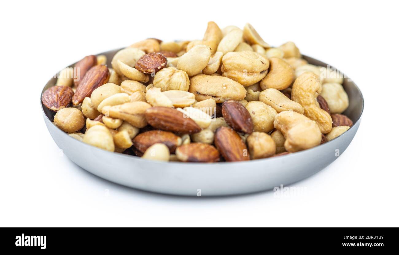 Fresh roasted nuts isolated on white background as close up shot ...