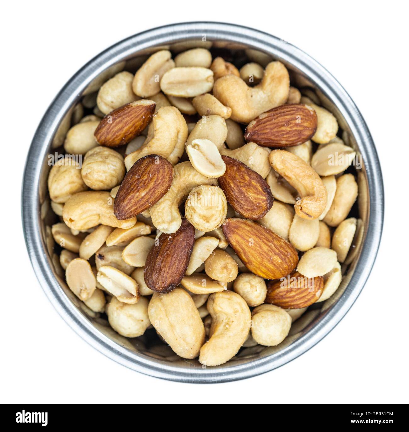 Portion of roasted nuts isolated on white background as close up shot ...