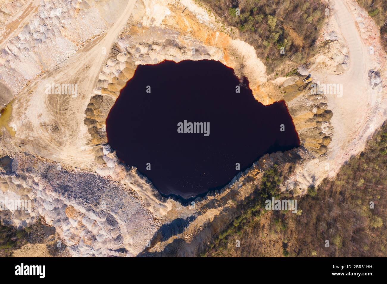 Aerial view to the open mine Stock Photo - Alamy