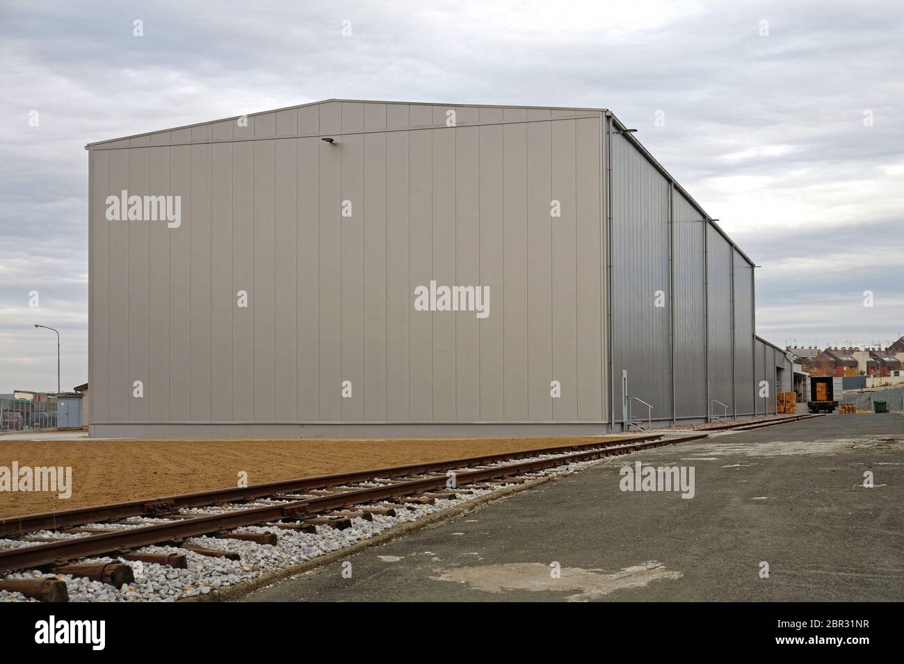 Big Warehouse Factory Building With Rail Tracks Stock Photo - Alamy