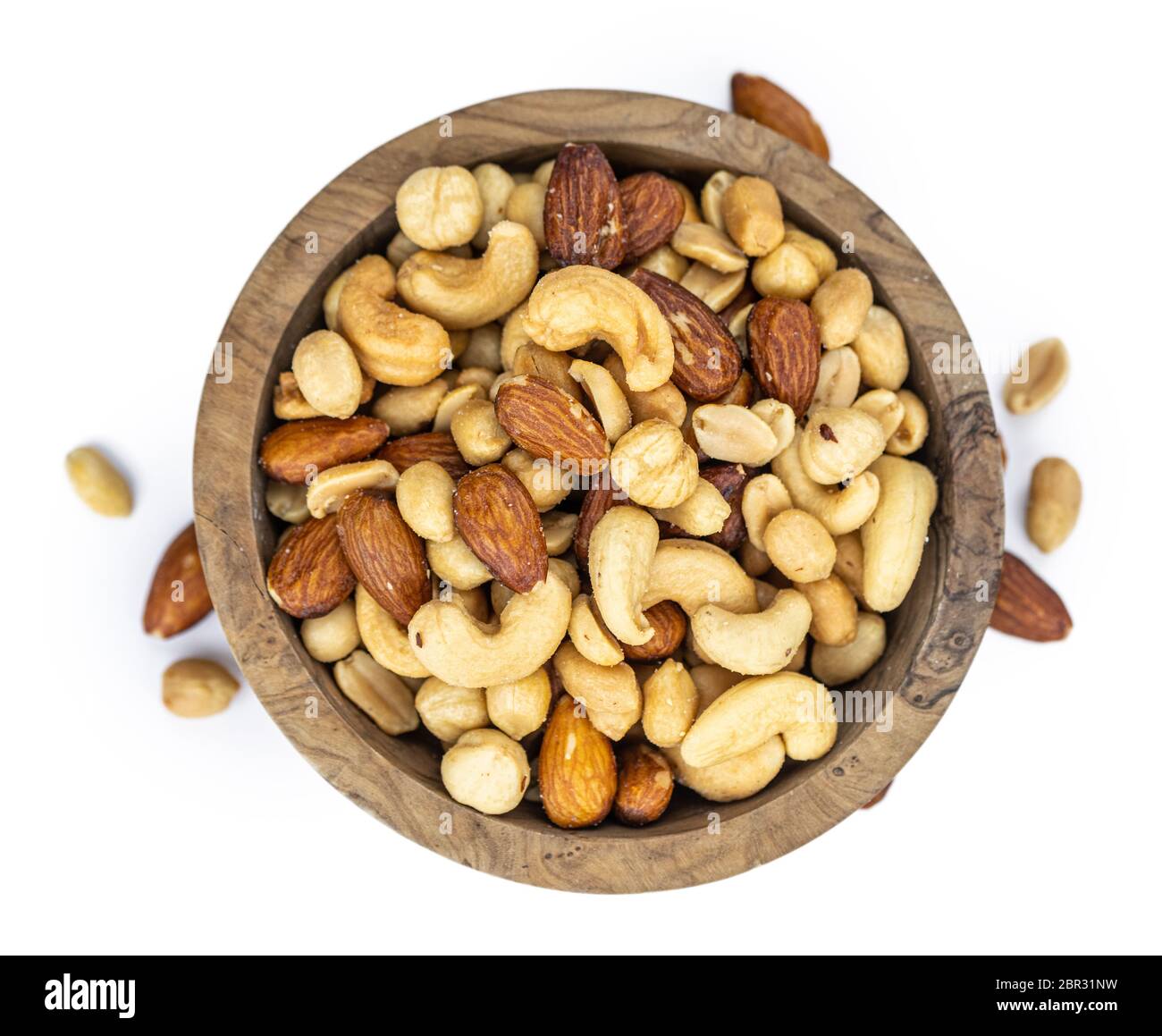 Fresh roasted nuts isolated on white background as close up shot ...