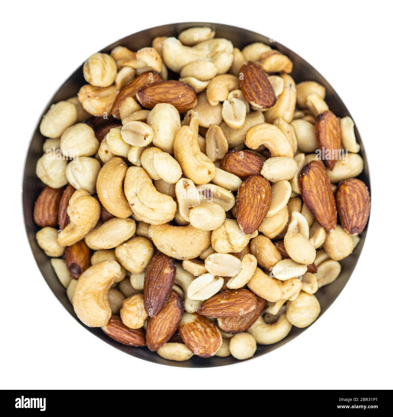 Portion of roasted nuts isolated on white background as close up shot ...