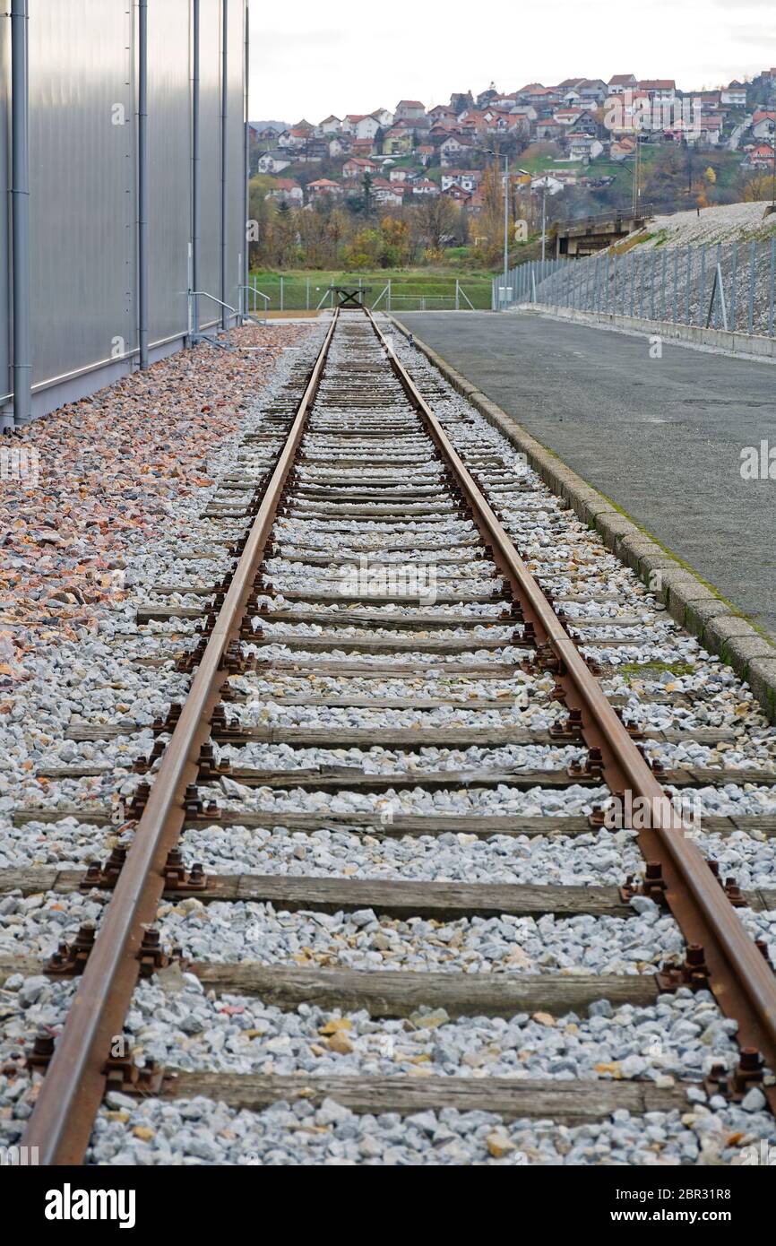 Rail Road Tracks Next to Warehouse Building Stock Photo - Alamy