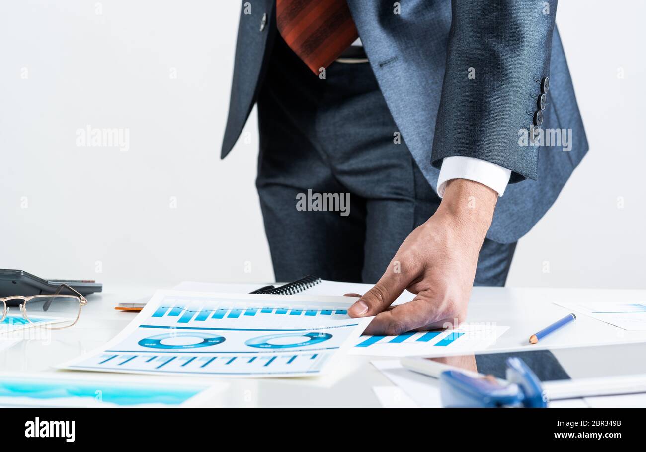 Close-up man hand with analytics Stock Photo - Alamy