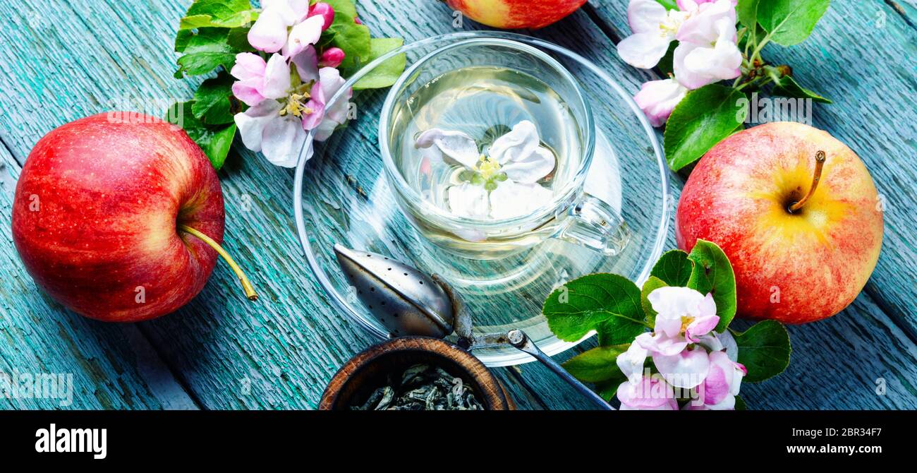 Red apples on wooden board.Cup of apple tea Stock Photo - Alamy
