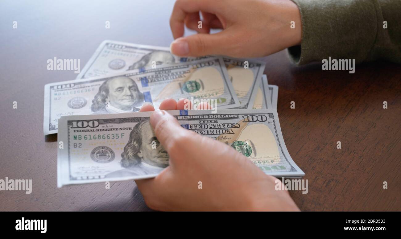Counting USD money banknote Stock Photo - Alamy