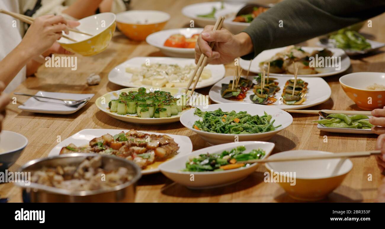 Chinese Family having dinner together at home Stock Photo - Alamy
