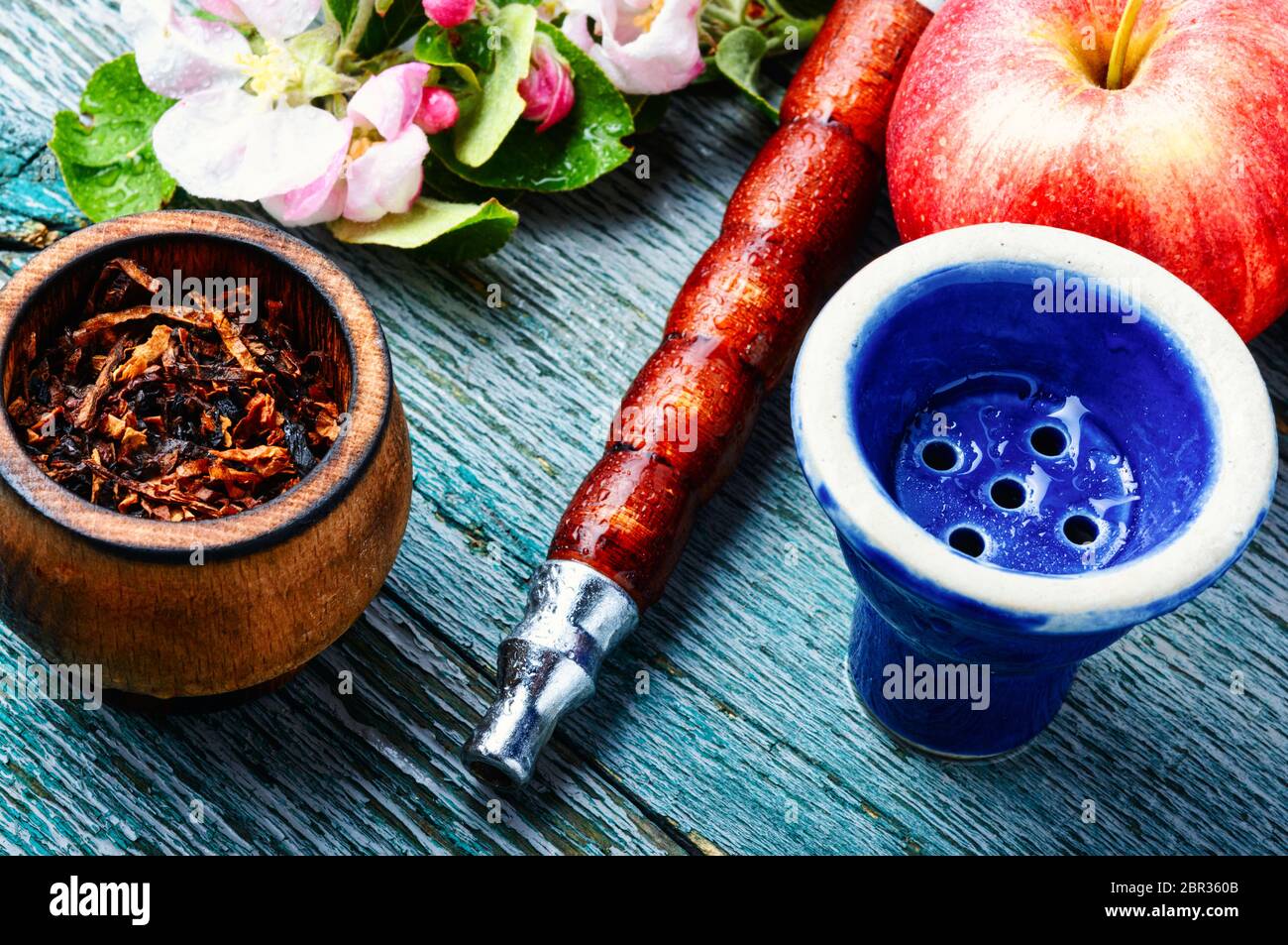 East smoking hookah. Arabian shisha with apple. Hookah and apple ...