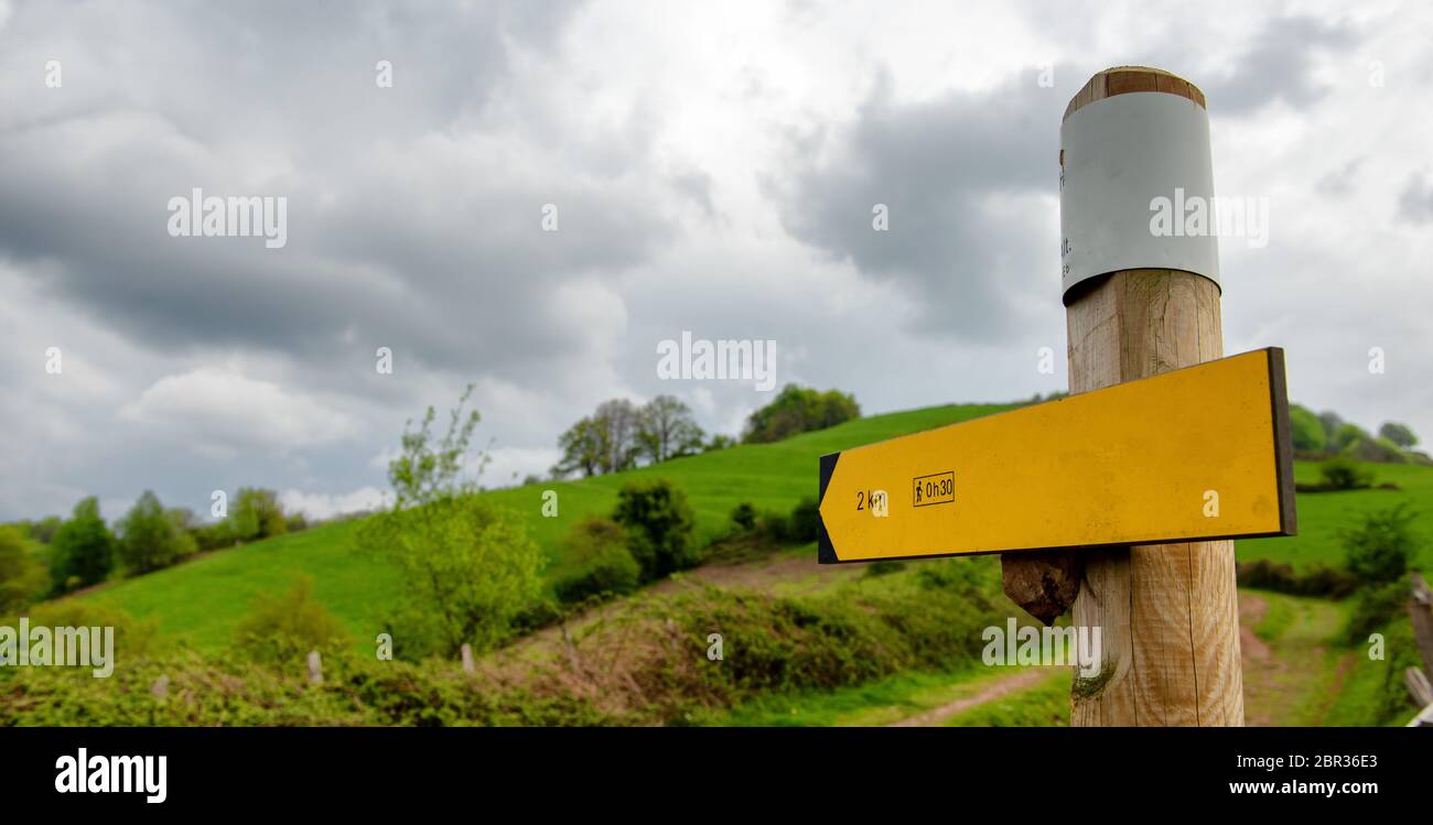 a yellow hiking direction sign, Pyrenees, France Stock Photo - Alamy